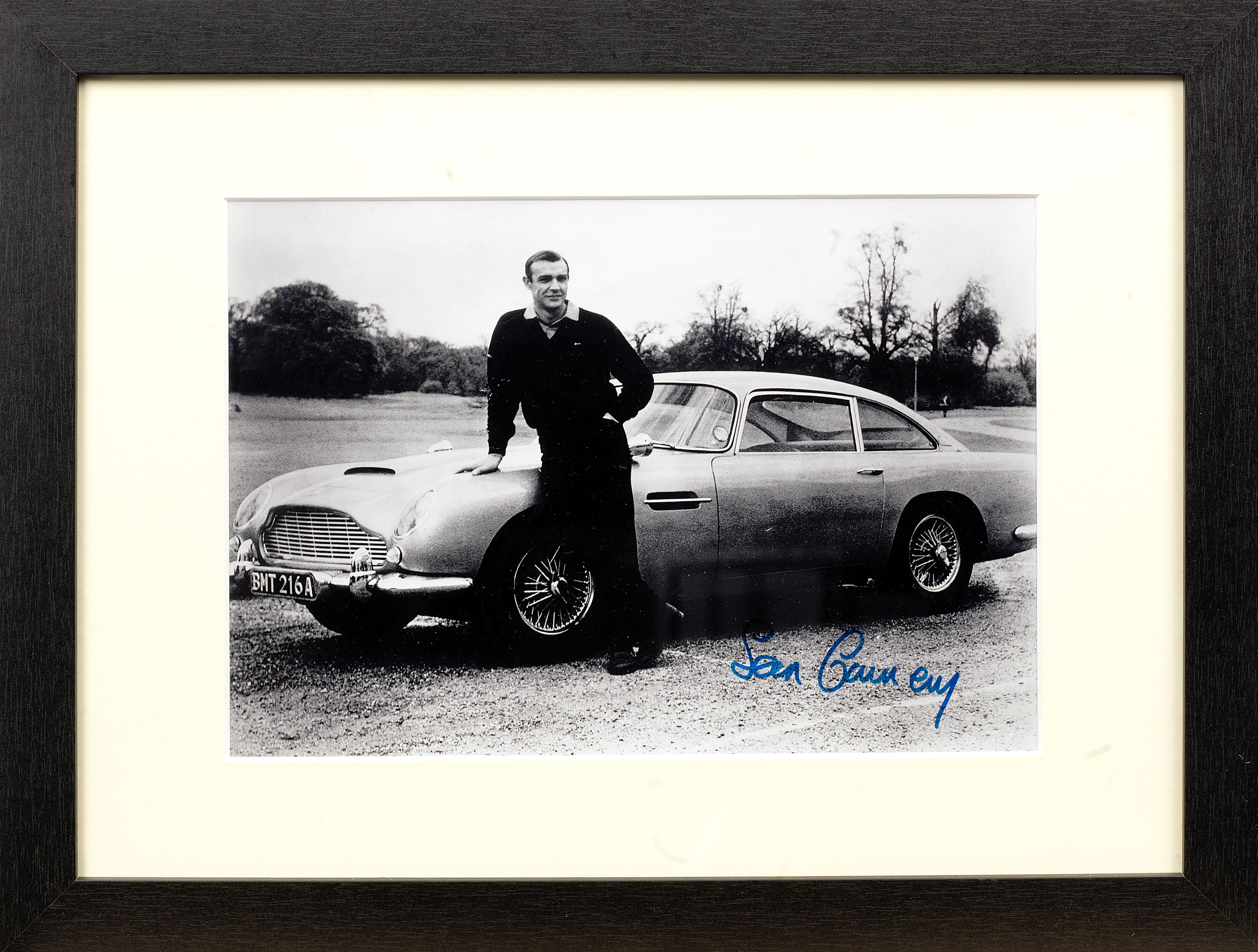 Bonhams Cars : Two framed 'Goldfinger' images with signatures, one ...