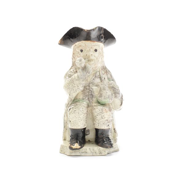 Bonhams : A creamware 'Step' Toby Jug, circa 1780