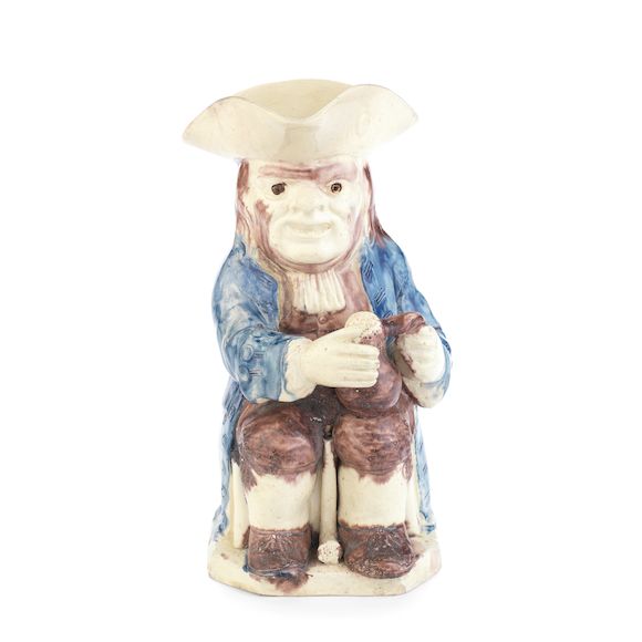 Bonhams : A creamware 'Step' Toby jug, circa 1780-85