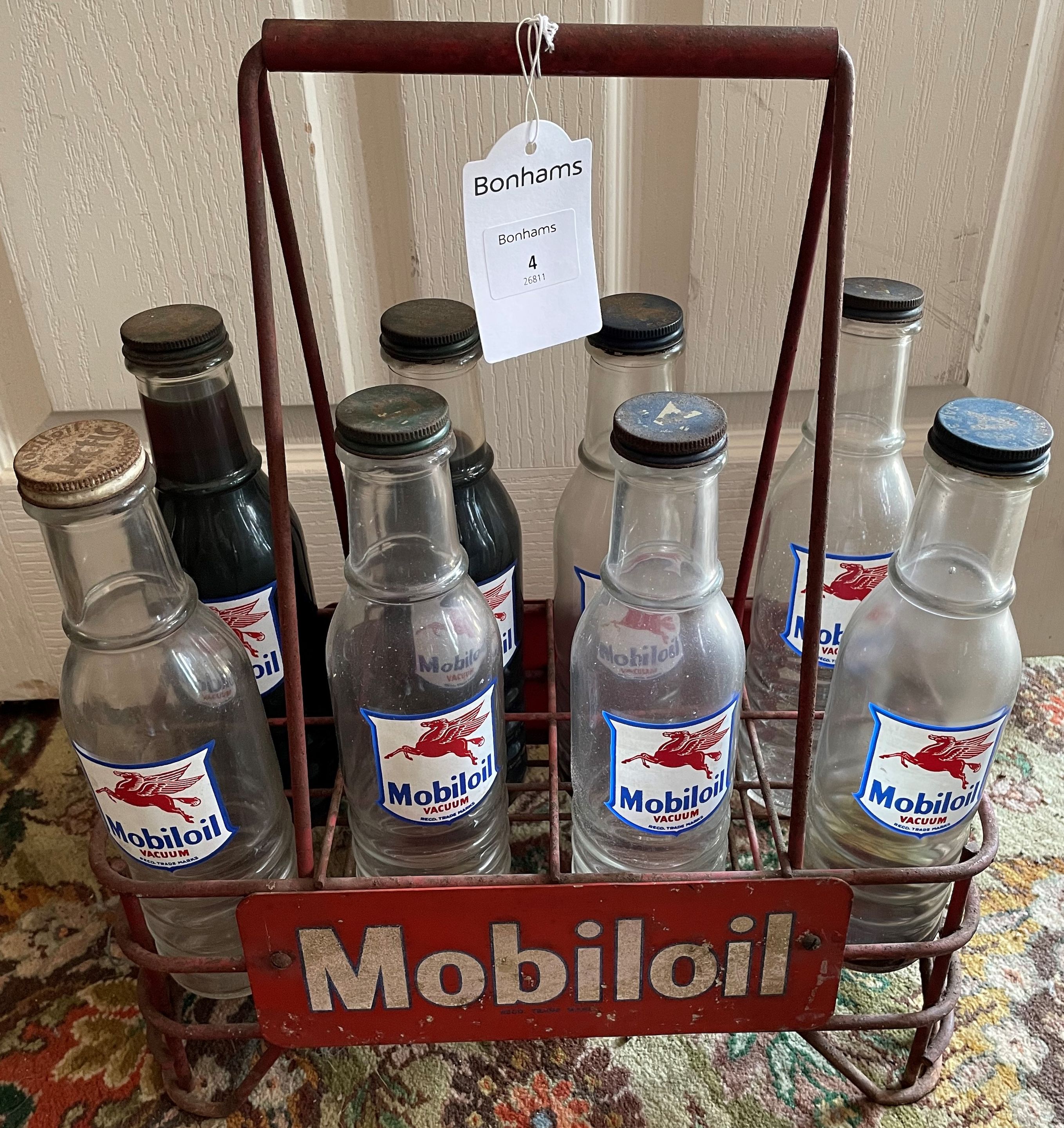Bonhams Cars : A 'Mobiloil' bottle rack, ((Qty))