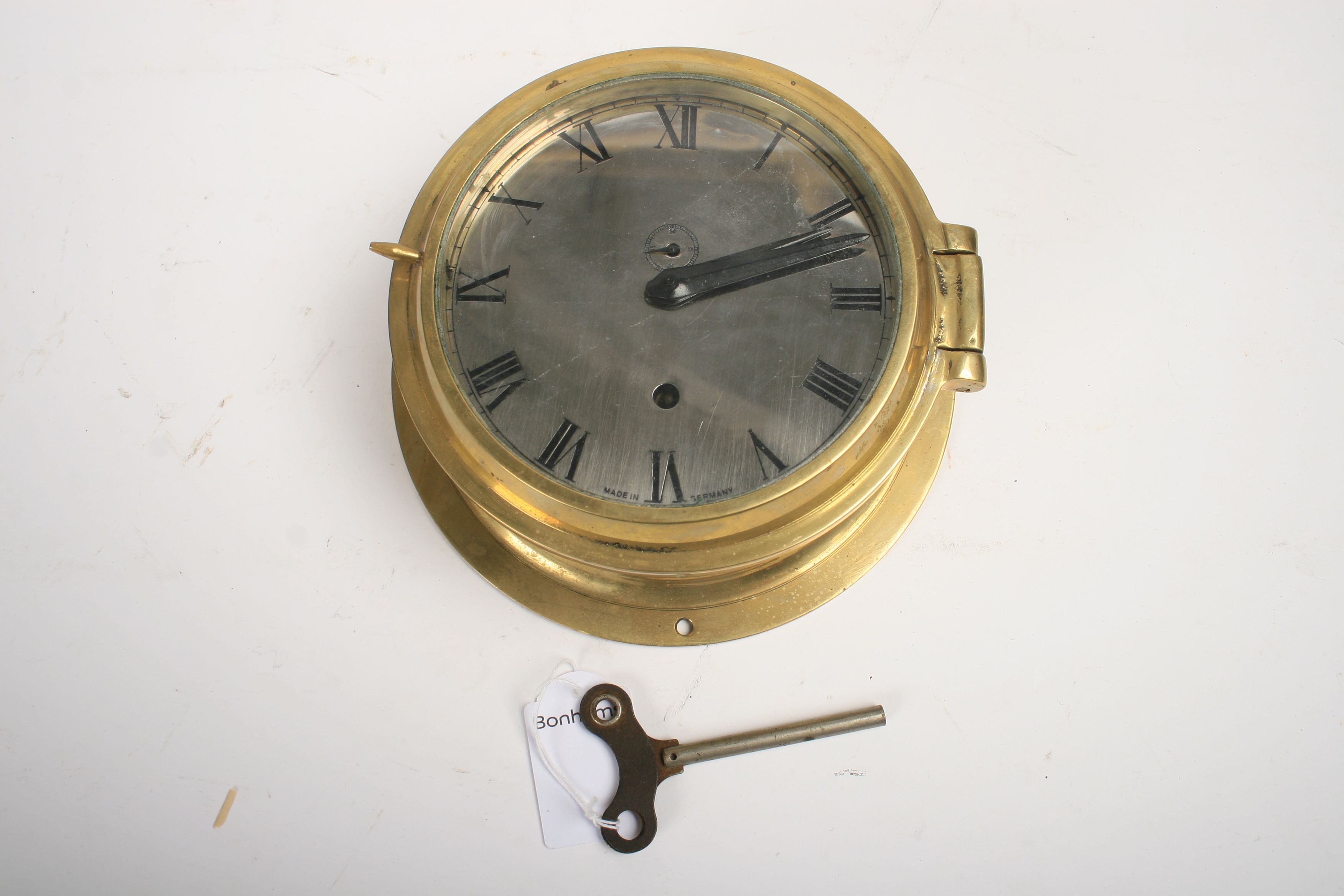 Bonhams Cars : A German brass bulkhead clock, ((2))