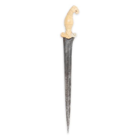 Bonhams : A Mughal ivory-hilted steel elephant head dagger (pesh-kabz ...