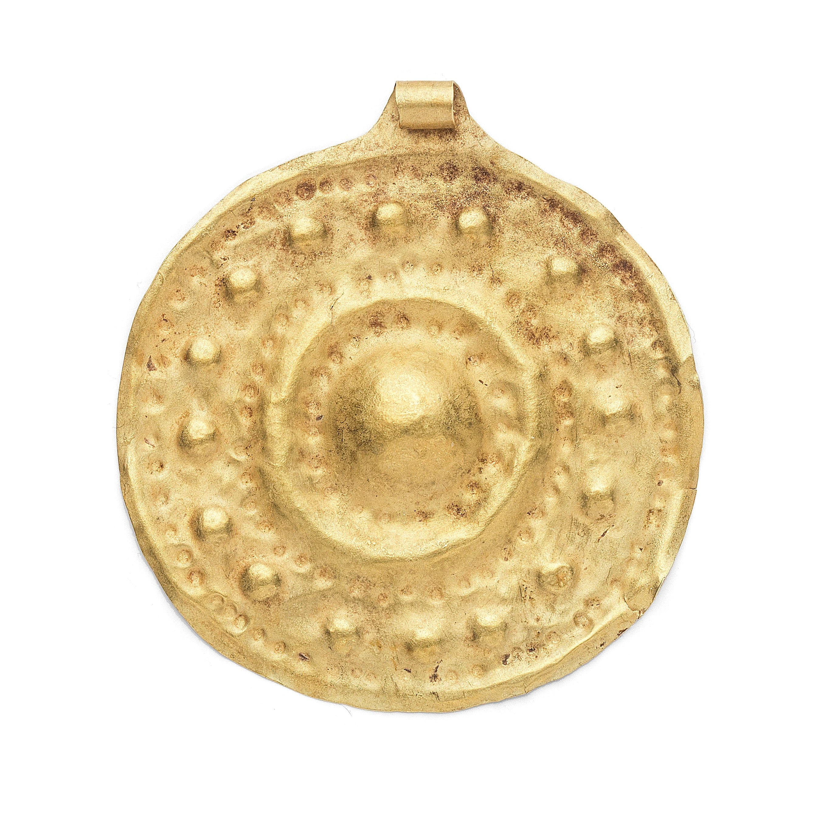 Bonhams : A Western Asiatic gold disc pendant