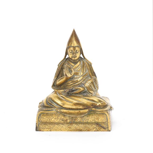 Bonhams : A GILT BRONZE SINO-TIBETAN FIGURE OF GELUKPA LAMA 19th century