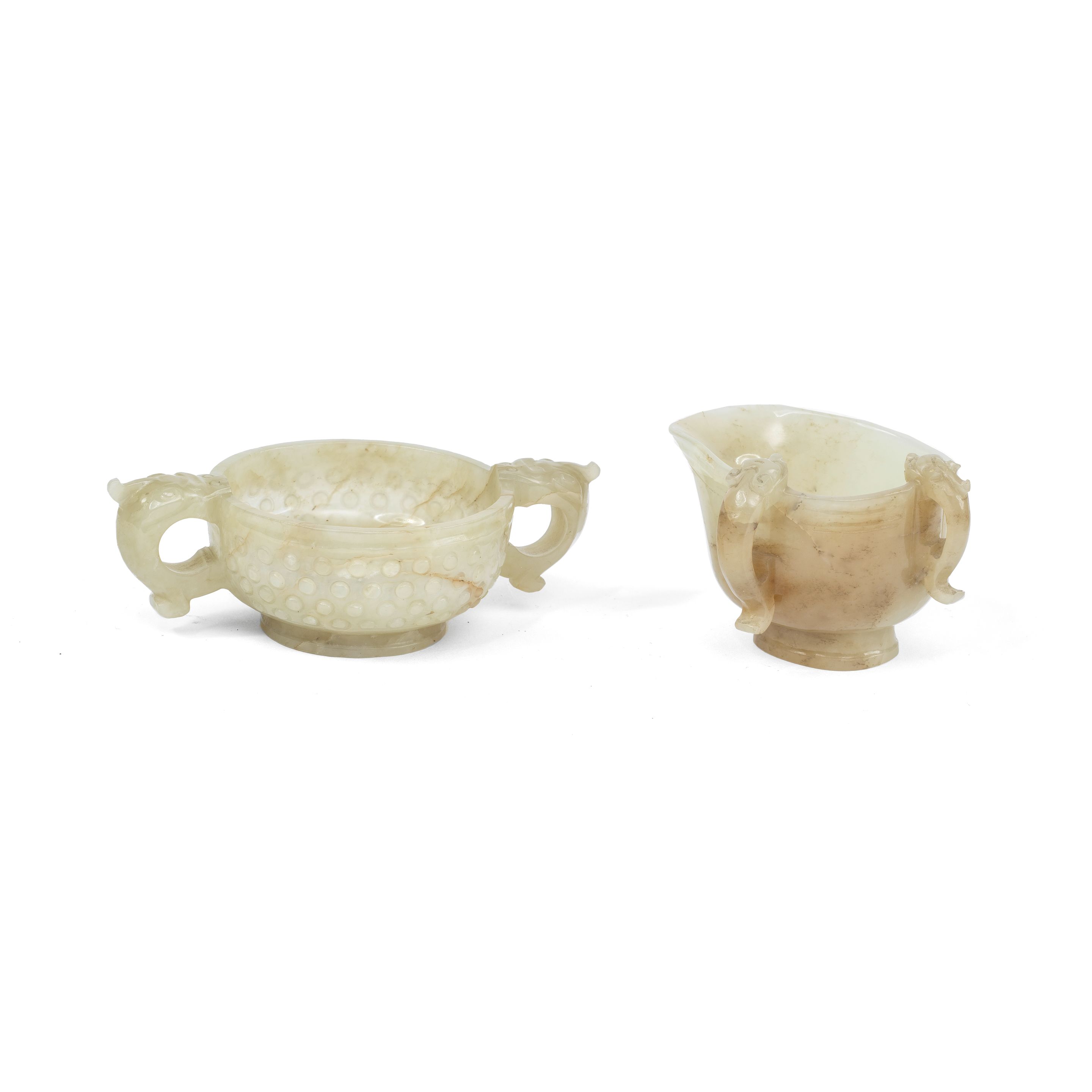 Bonhams : A PALE GREEN AND RUSSET JADE POURING VESSEL AND A TWO-HANDLED ...