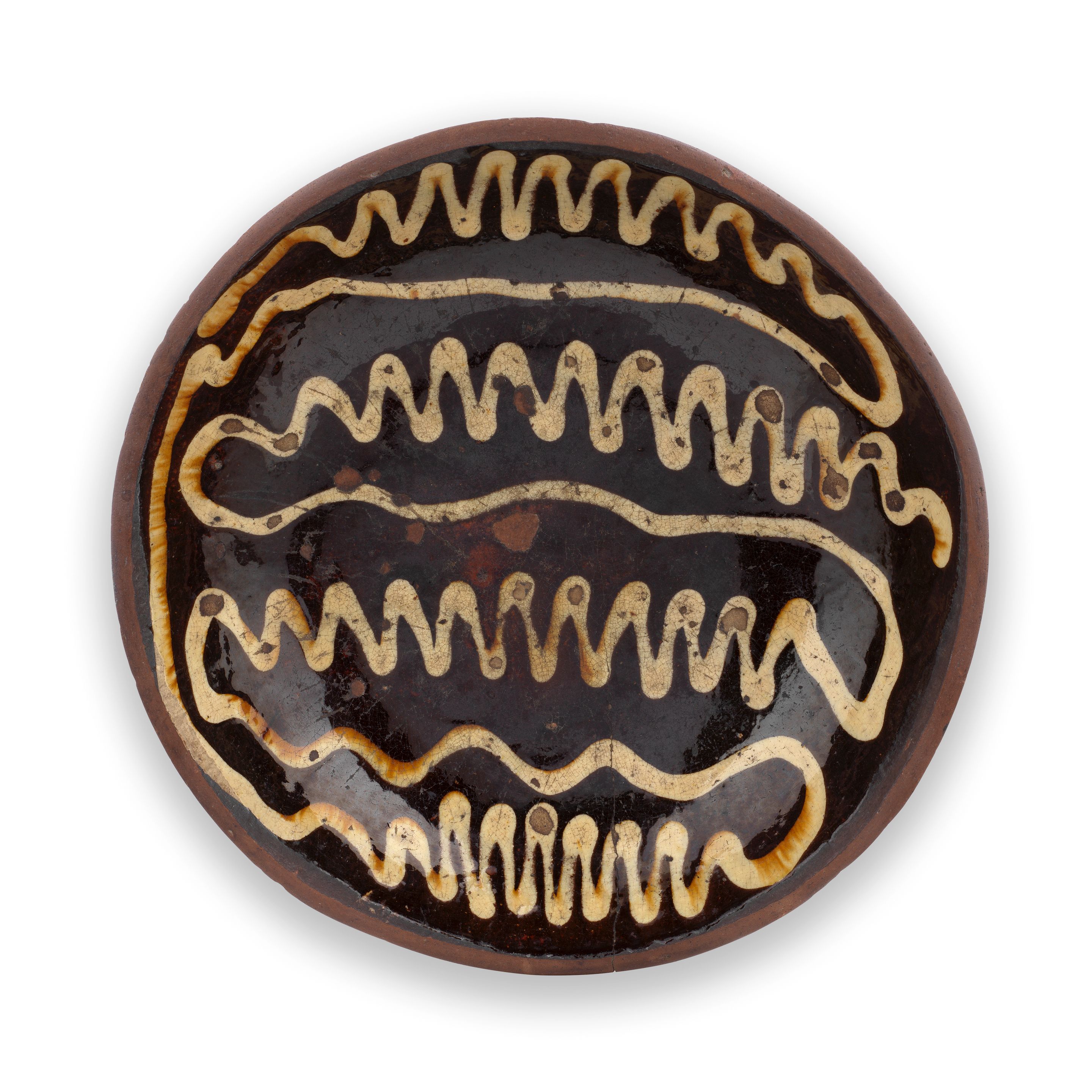 Bonhams : An English Slipware dish, 18th century