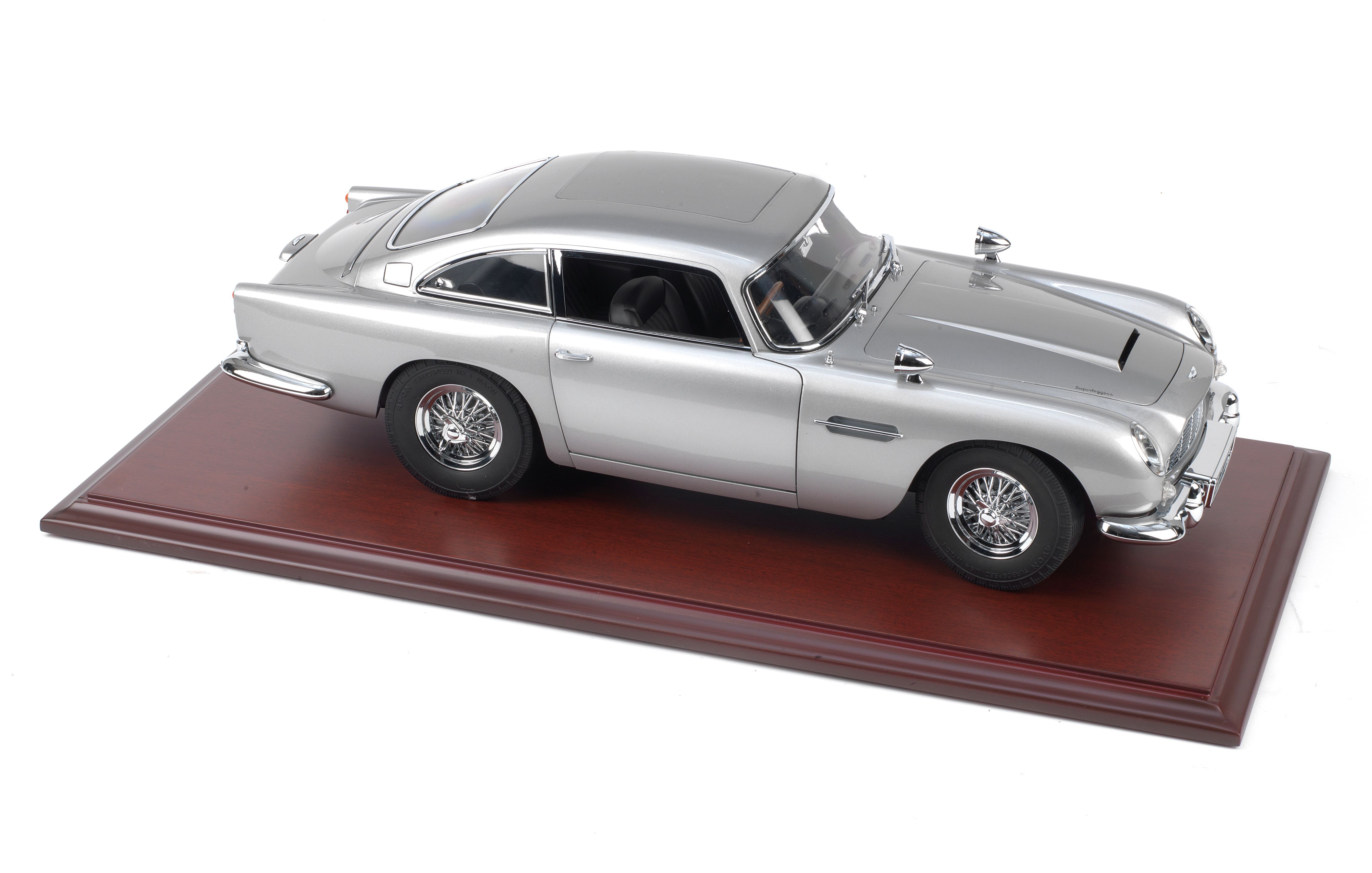 A finely detailed 1:8 scale model of the James Bond 'Goldfinger' Aston ...