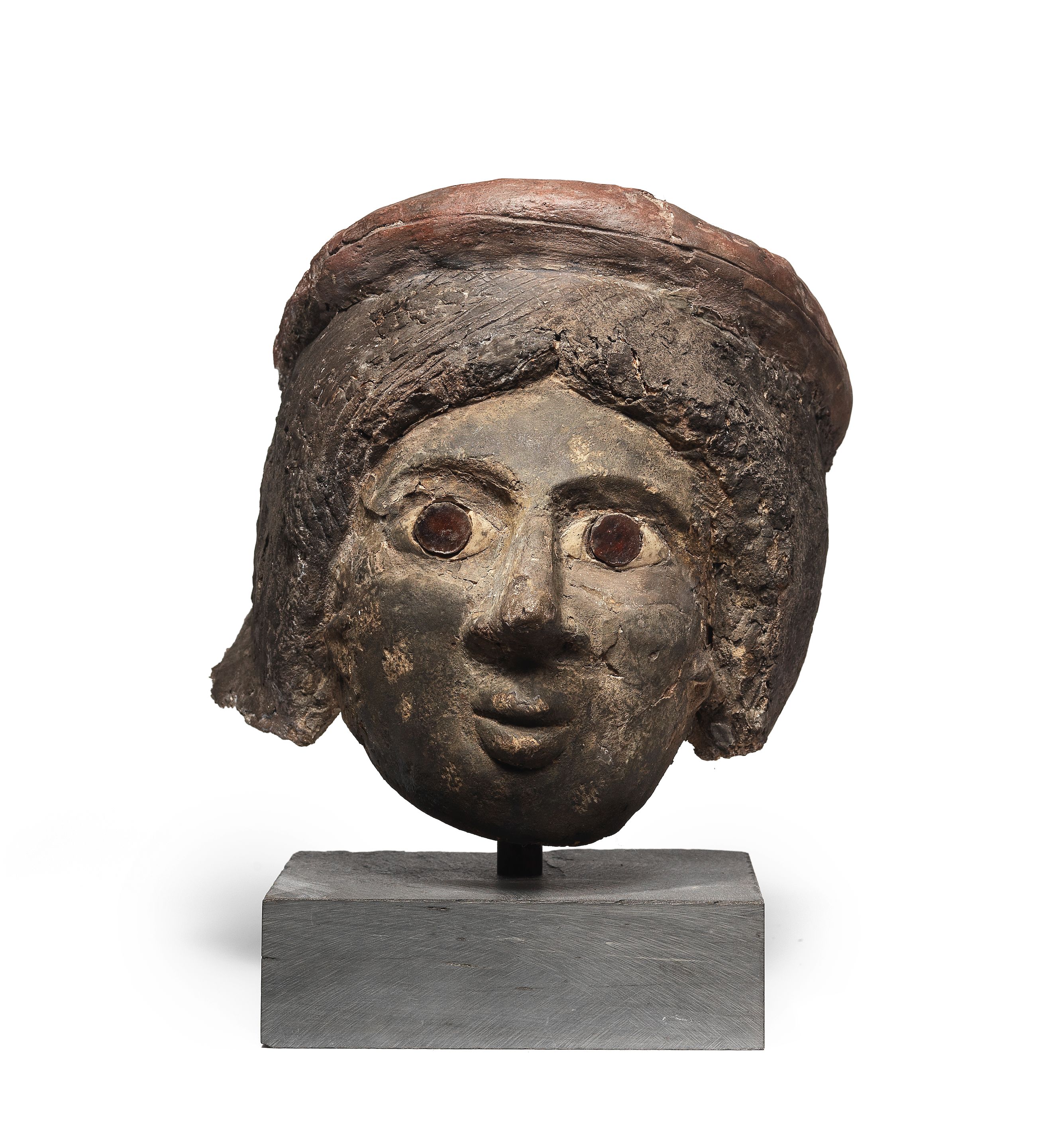 Bonhams : A Romano-Egyptian plaster funerary female head