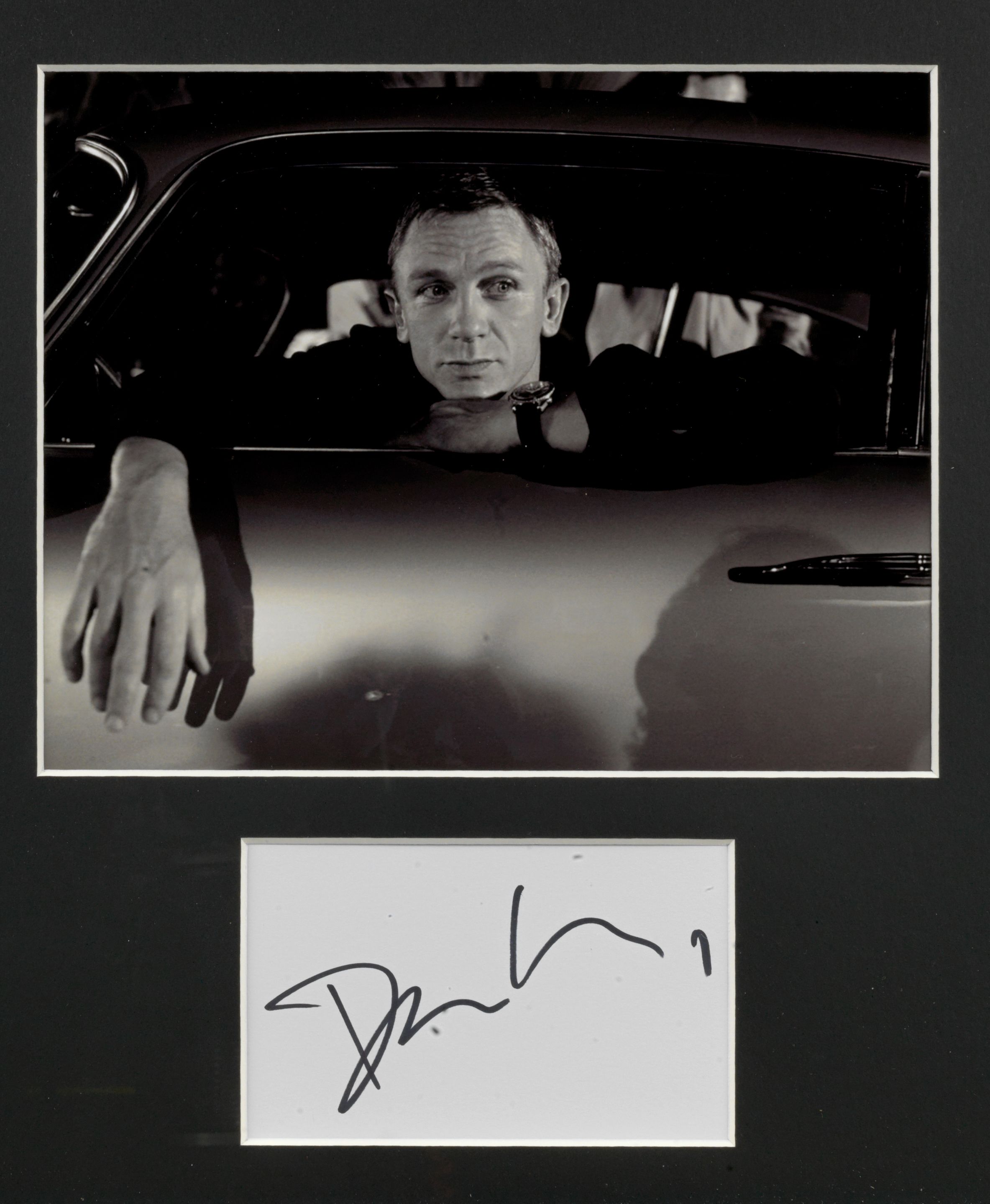 Bonhams Cars : A photograph with signature, Daniel Craig as James Bond,
