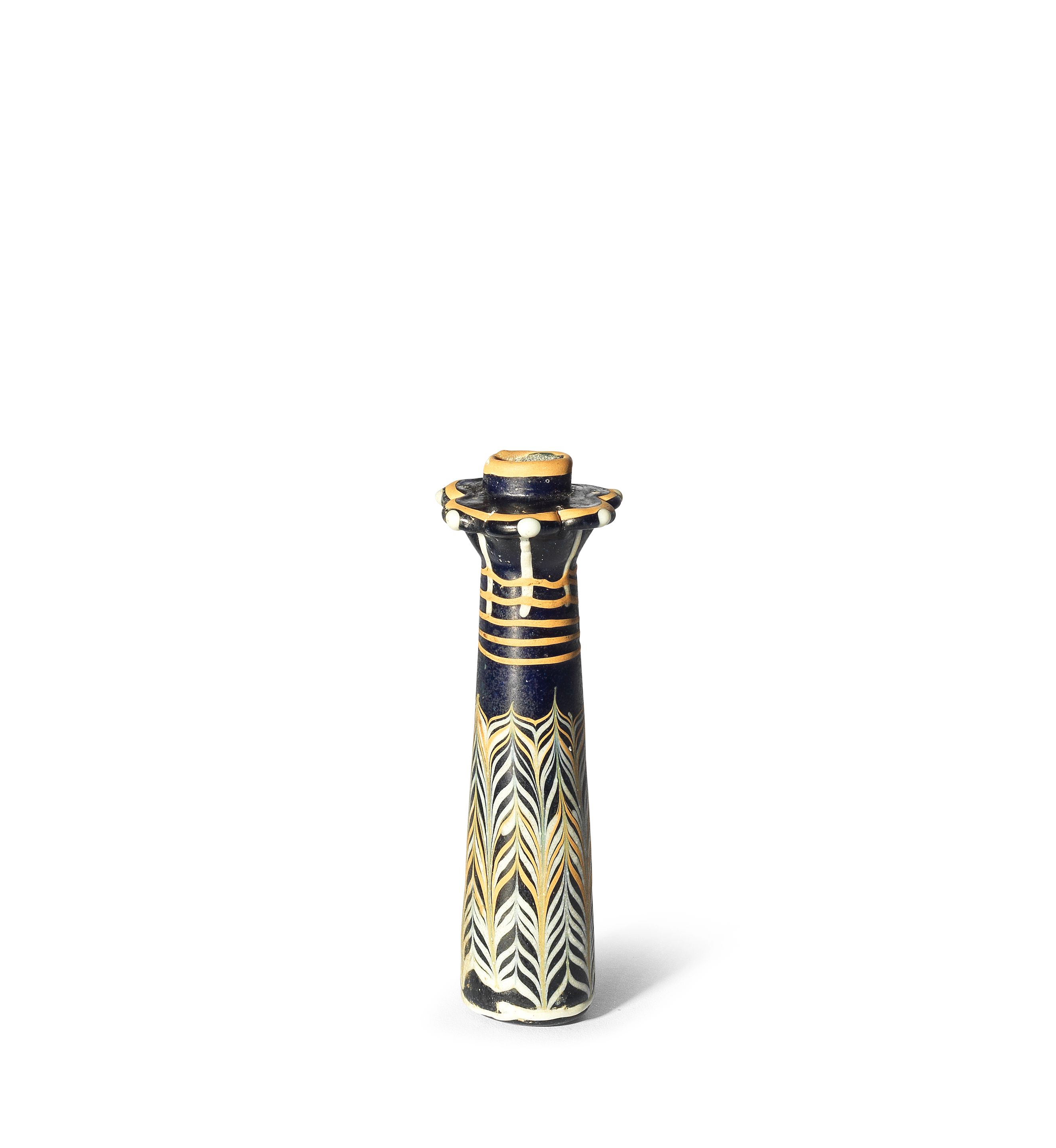 Bonhams : A rare Egyptian rod-formed glass palm column kohl vessel