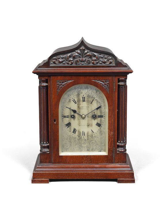 Bonhams : A good early 20th century carved mahogany table clock, dated ...
