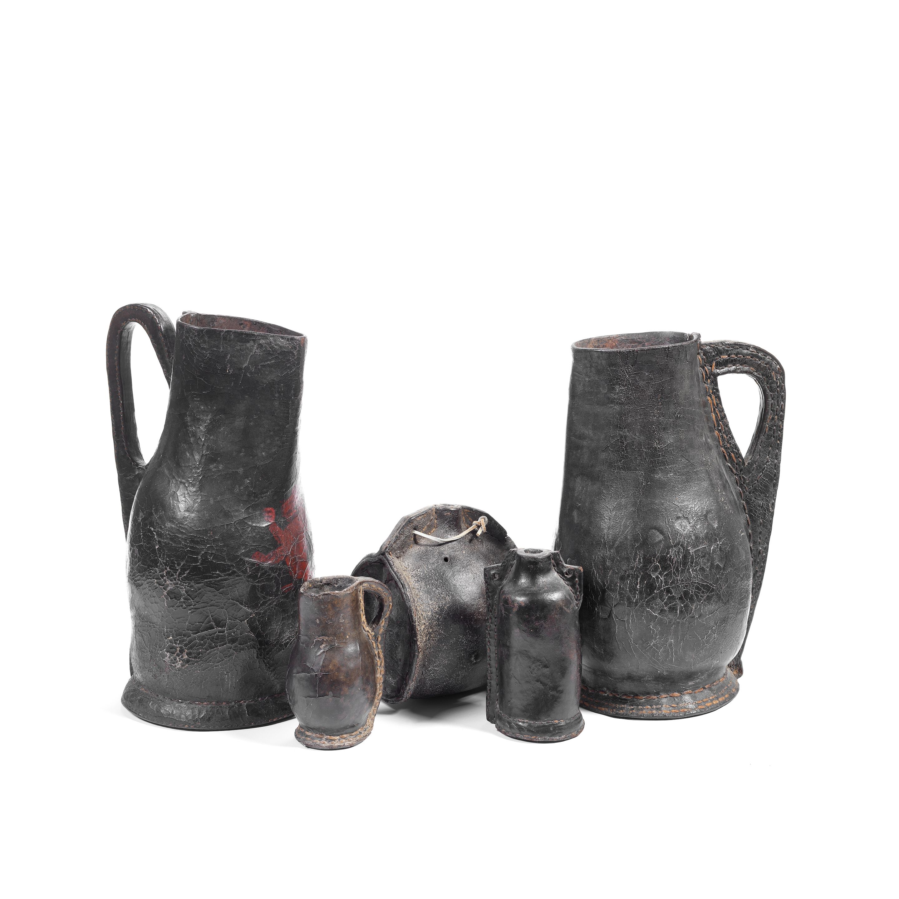 Bonhams : Two large leather bombards, together with a small bombard, a ...