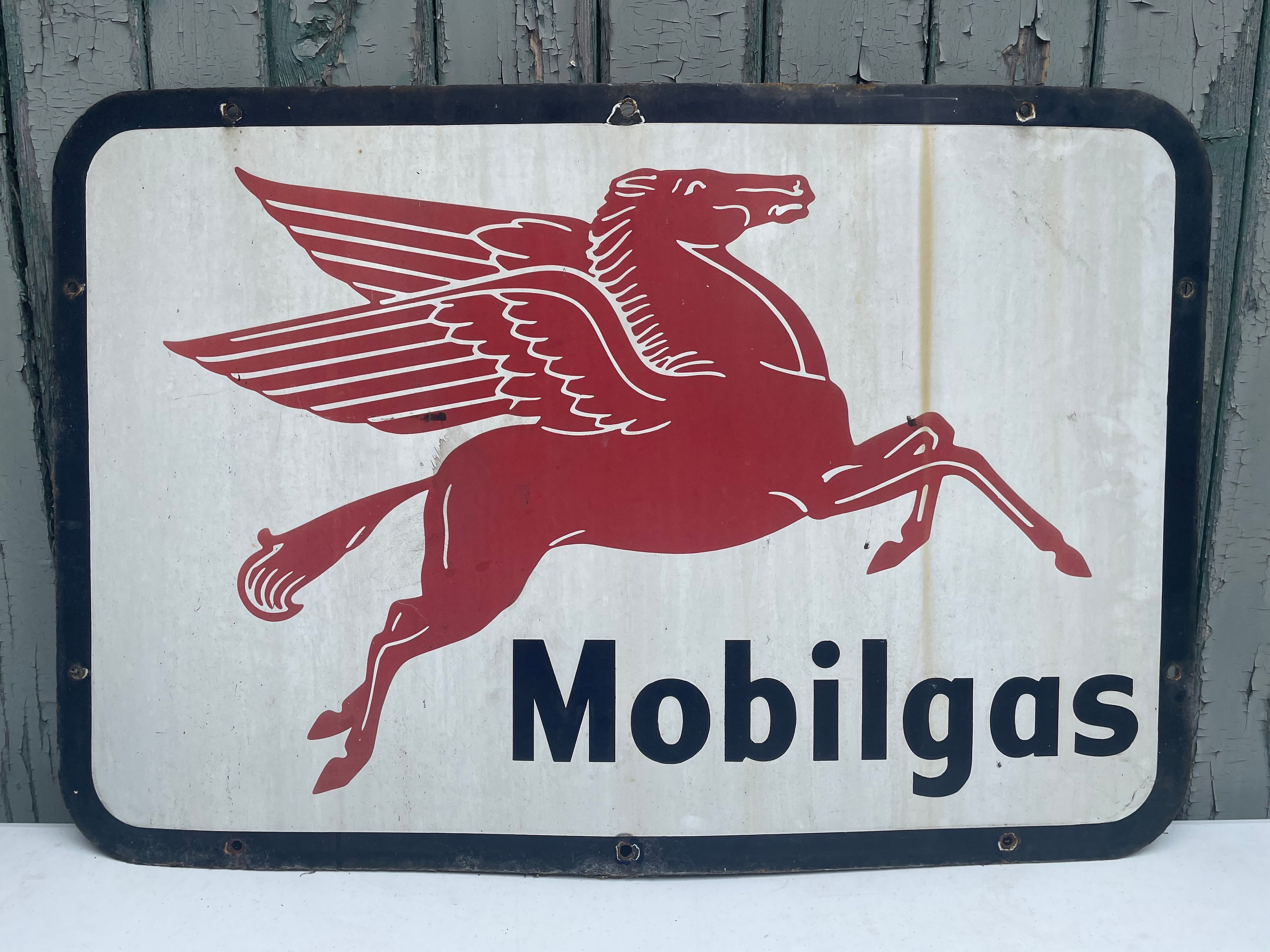 Bonhams Cars : A Mobilgas enamel sign,
