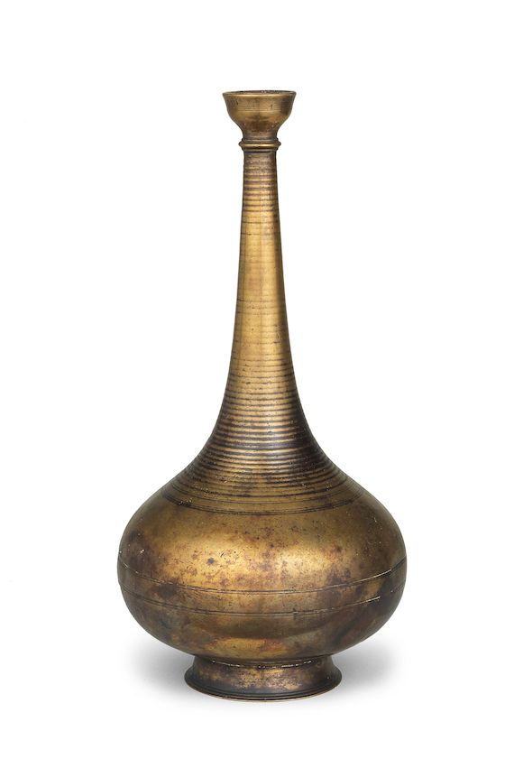 Bonhams : An incised bronze water bottle Mughal India, 16th/ 17th Century