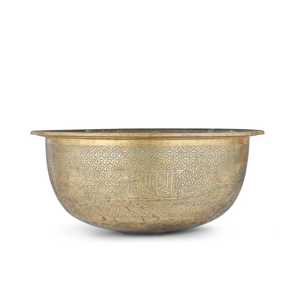 Bonhams : A large Mamluk engraved brass basin Egypt or Syria, late 15th ...