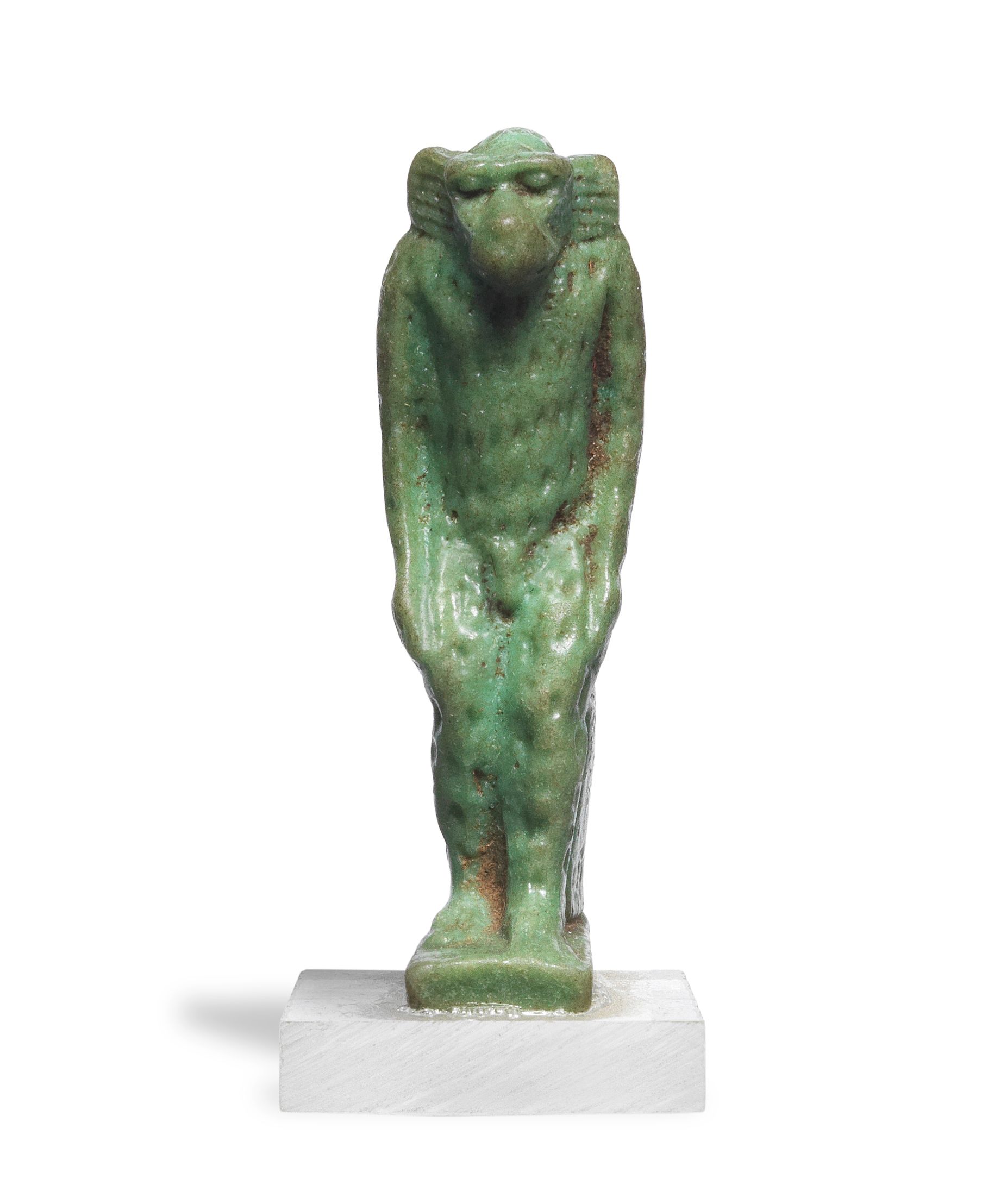 Bonhams : An Egyptian green glazed faience amulet of a vervet monkey