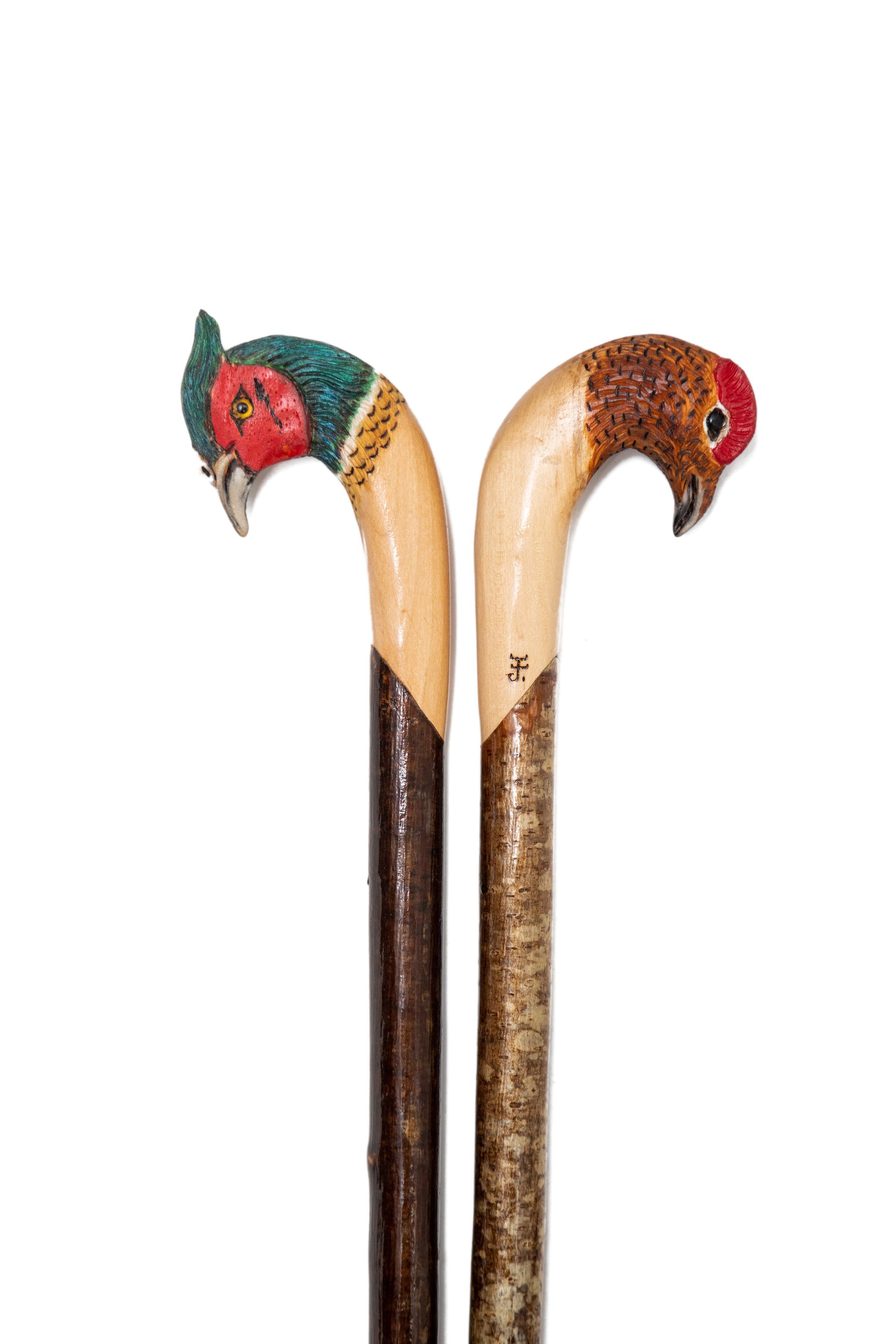 Bonhams : Two carved sporting staffs by Ian Jones