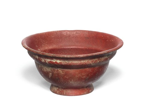 Bonhams : A Roman opaque red glass patella cup