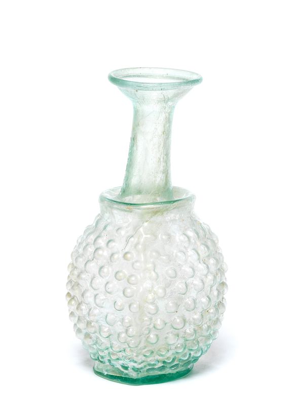 Bonhams : A Roman pale green glass grape flask