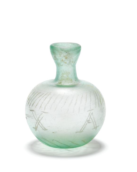 Bonhams : A Roman pale green glass flask with Greek inscription