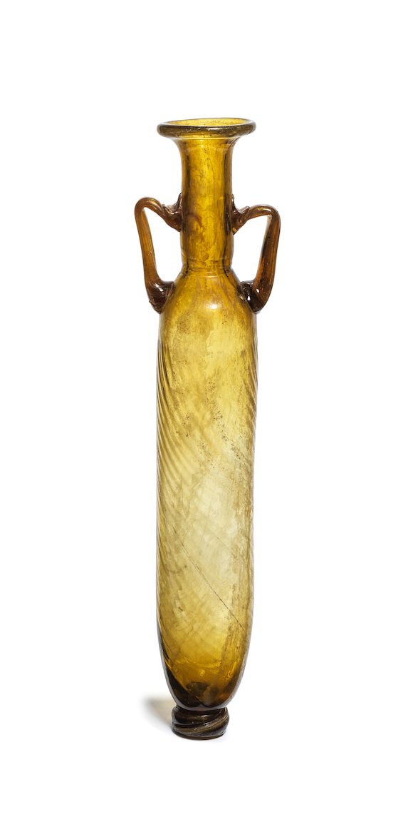 Bonhams : A tall Roman amber glass amphora