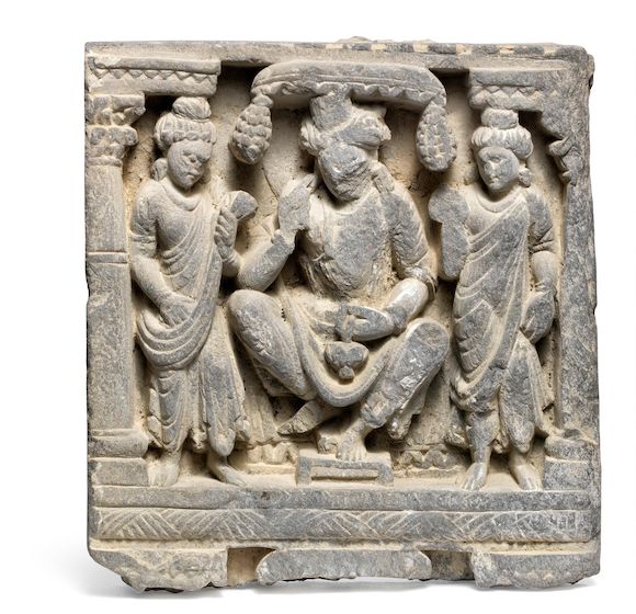 Bonhams : A Gandhara grey schist stone relief of Maitreya seated on ...