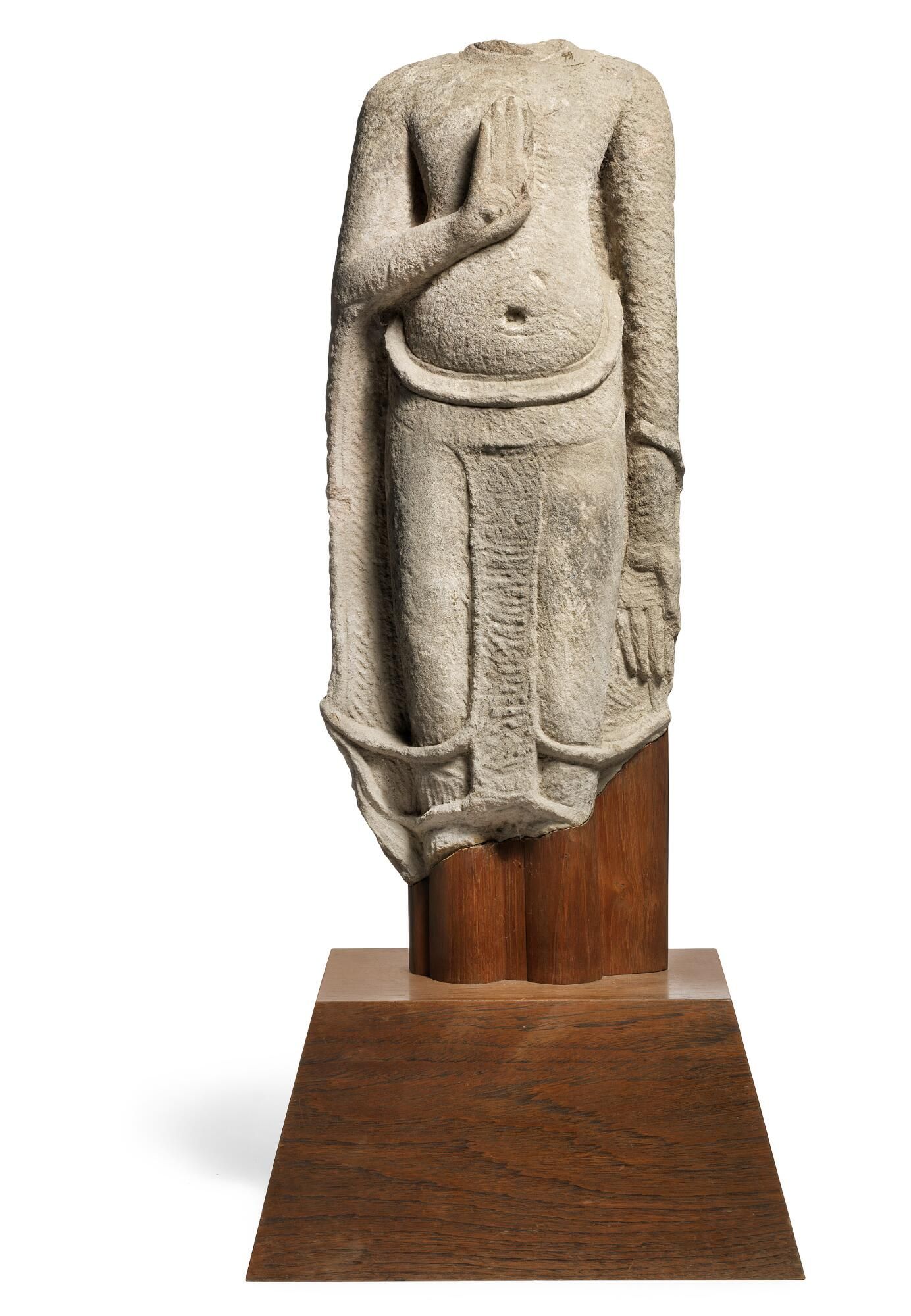 Bonhams : A buff sandstone Buddha torso. Thailand, 14th century. H. 62 cm.