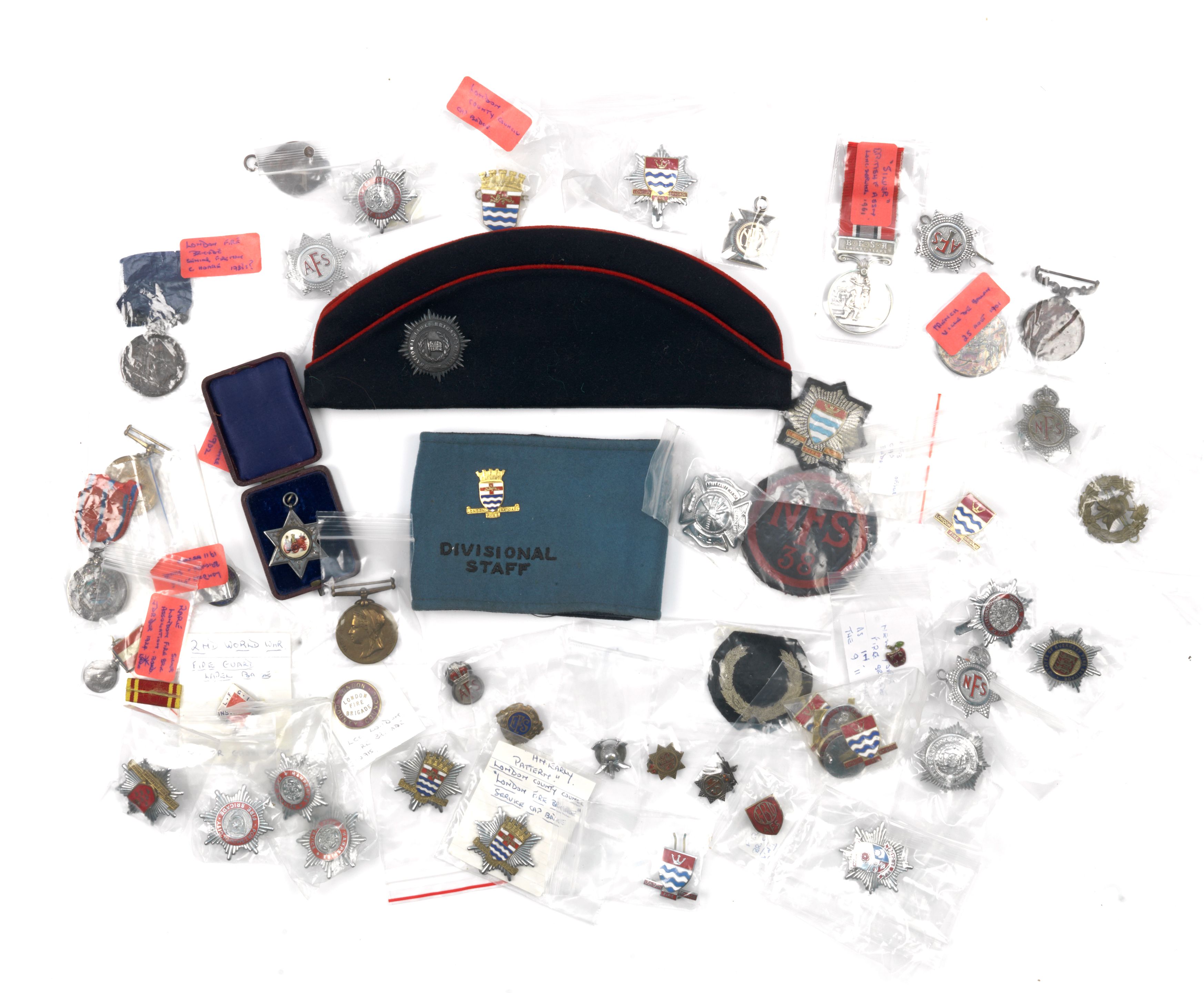 Bonhams Cars : Assorted Fire Brigade/Service medals and cap badges and ...