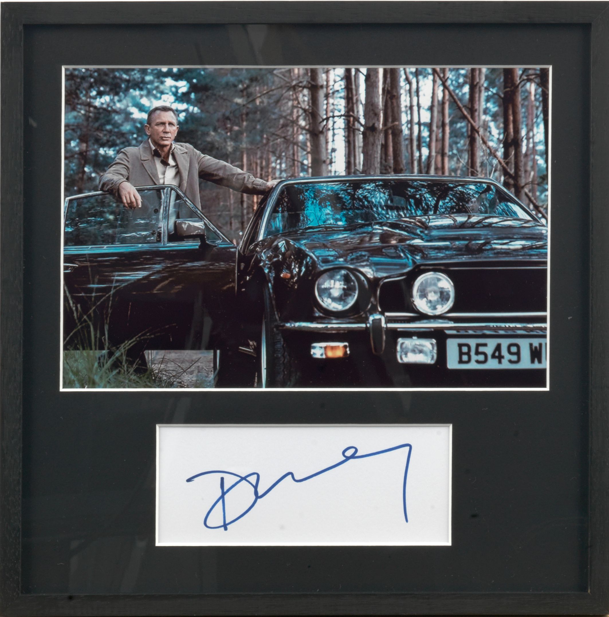 Bonhams Cars : A framed photograph of Daniel Craig with the James Bond ...