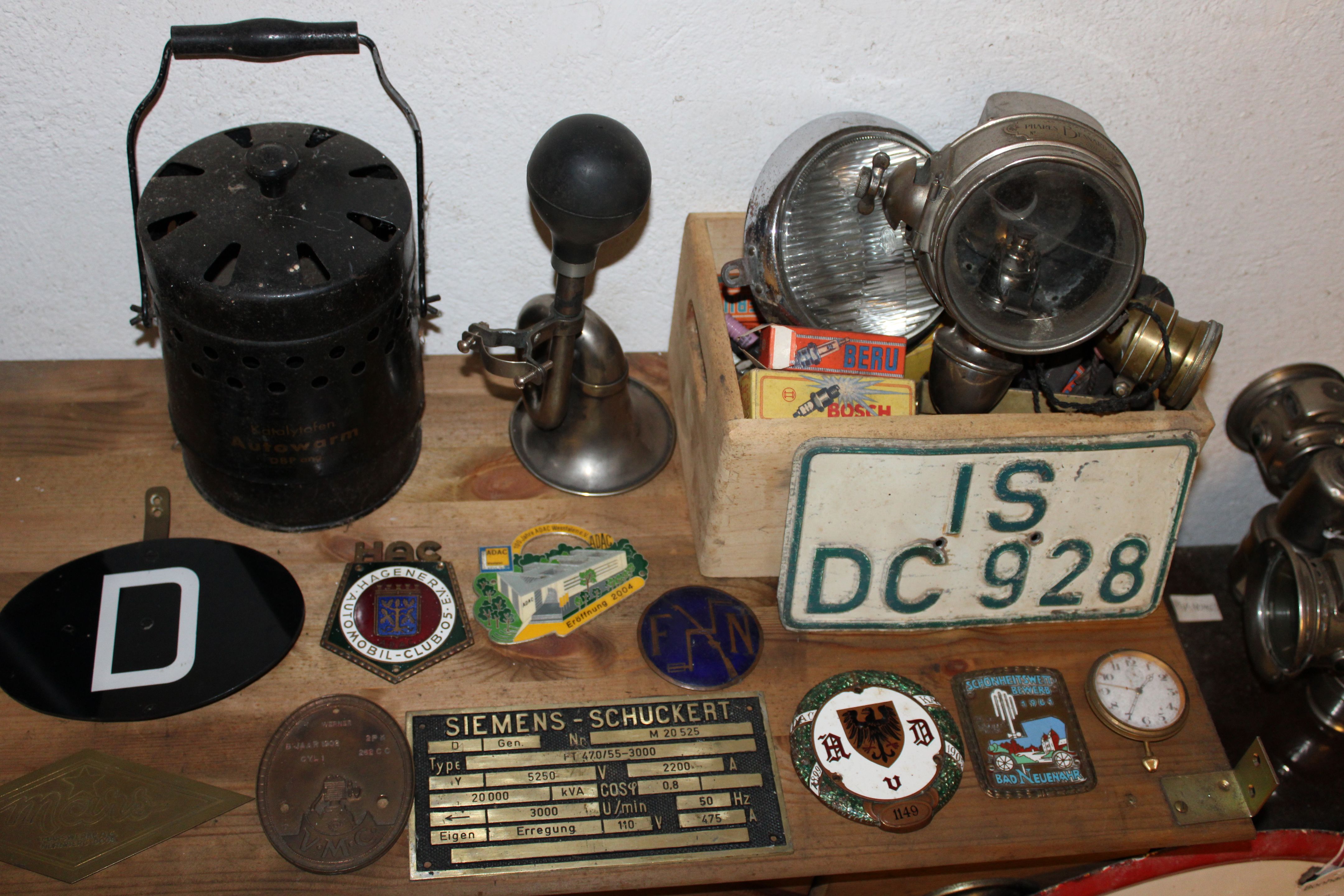 Bonhams Cars : Assorted spark plugs, badges and motoring accessories, (Qty)