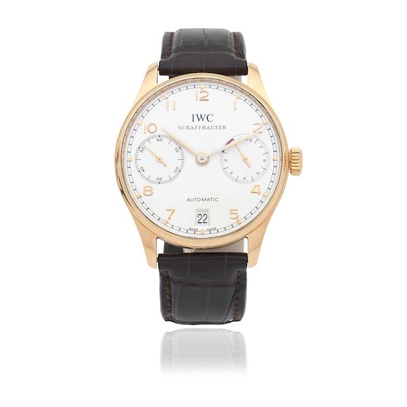 Bonhams : IWC. An 18K gold automatic calendar wristwatch with 7 day ...