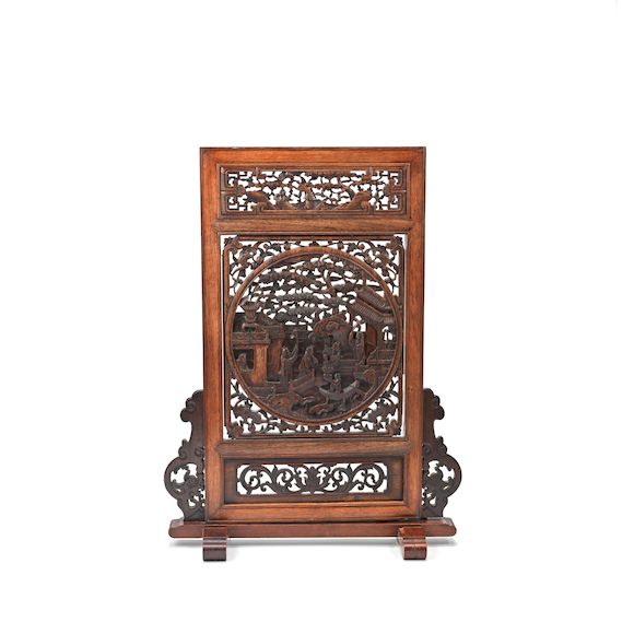 Bonhams : A HUANGHUALI CARVED OPENWORK SCREEN 19th/20th century