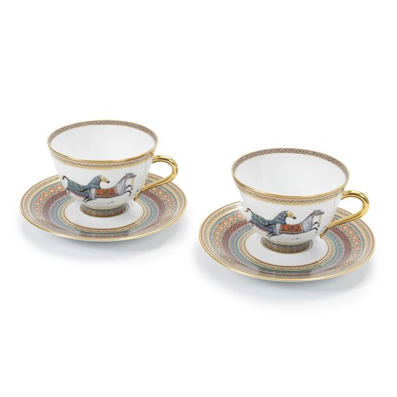 Bonhams : Hermès: a Set of Two 'Cheval d'Orient' Tea Cups and Saucers c ...