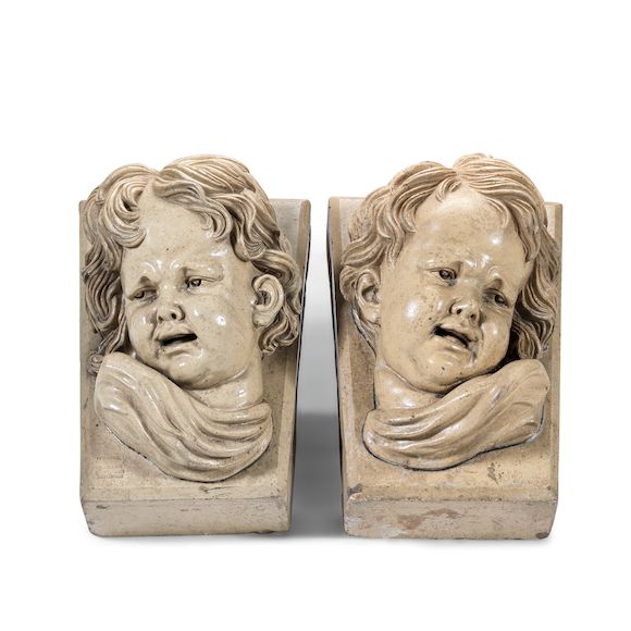 Bonhams : A pair of late 19th century buff glazed terracotta mask head ...