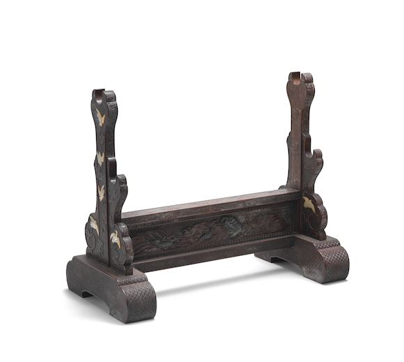 Bonhams : A CARVED WOOD KATANAKAKE (SWORD STAND) FOR A DAISHO (SET OF ...