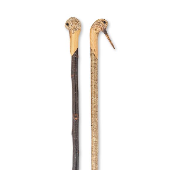 Bonhams : Two carved sporting staffs by Ian Jones