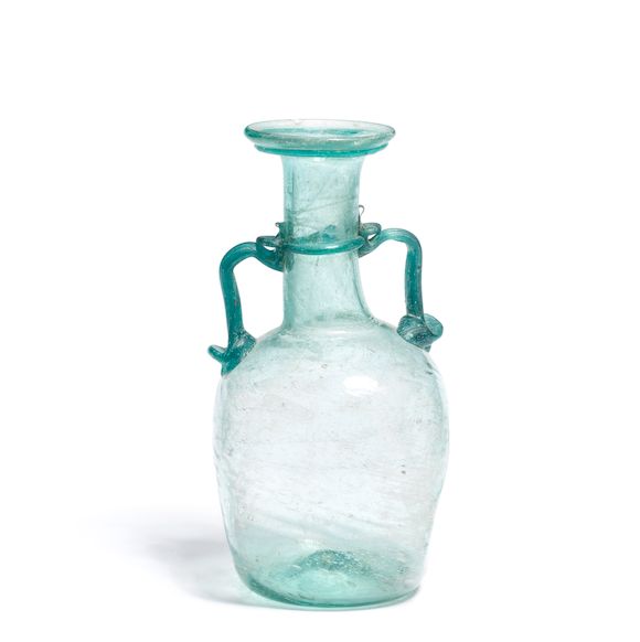 Bonhams : A Roman turquoise glass two-handled flask