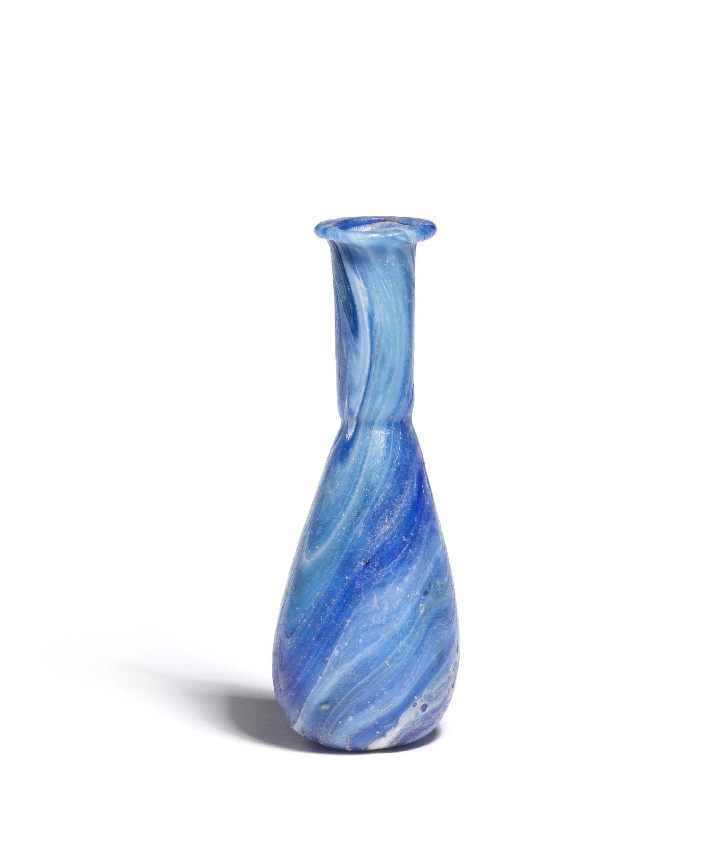 Bonhams : A Roman blue and white marbled glass unguentarium