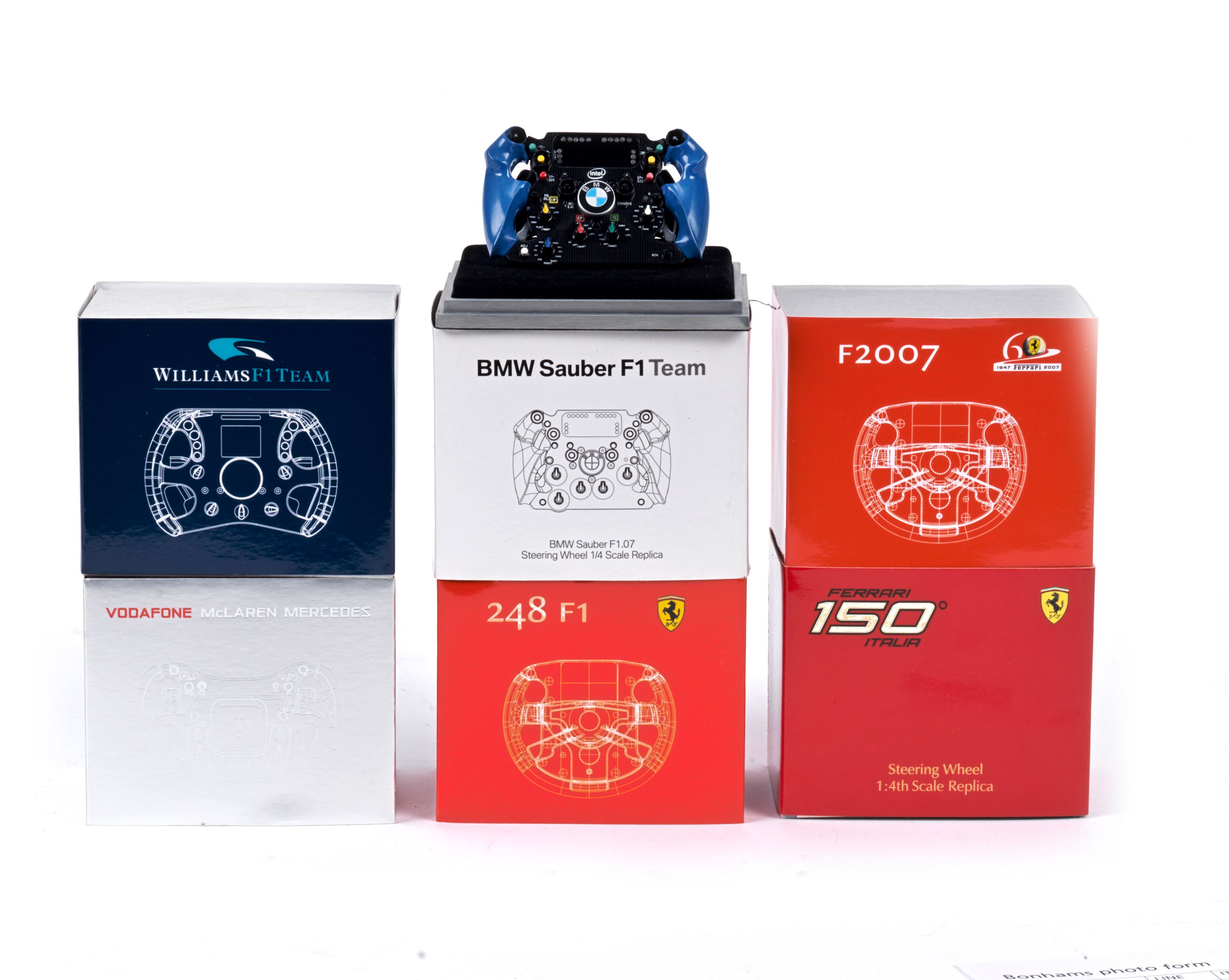 Bonhams Cars : Six 1:4 scale miniature F1 steering wheel models by ...