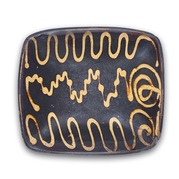 Bonhams : An English slipware dish, 18th century