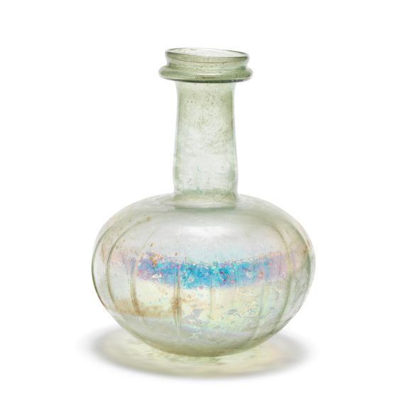 Bonhams : A large Roman pale green glass ribbed flask
