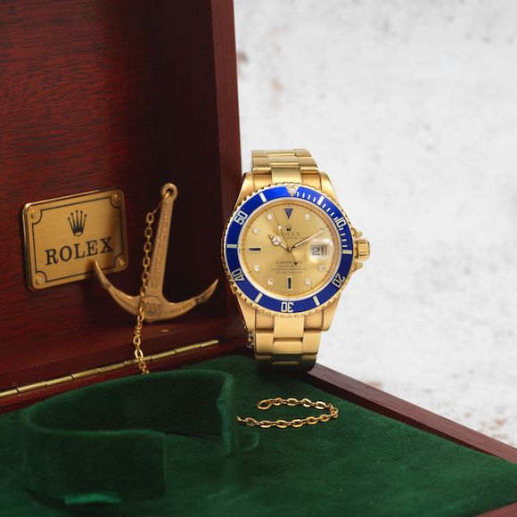 Bonhams : Rolex. A fine 18K gold automatic calendar bracelet watch ...