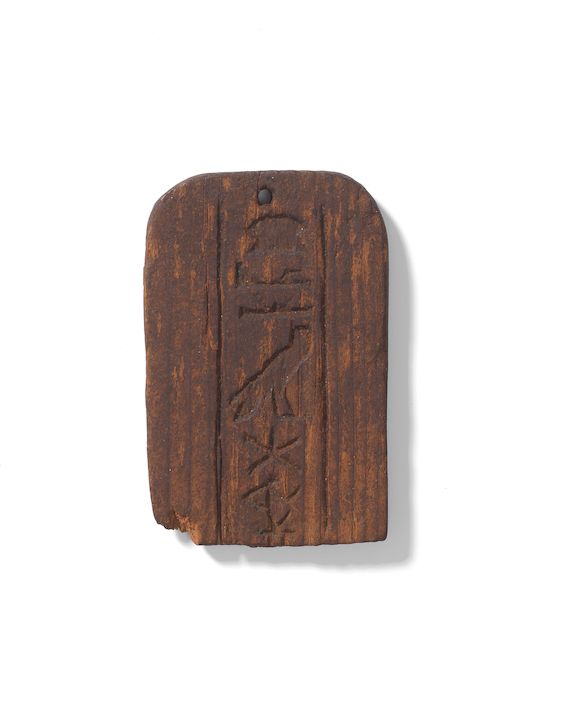 Bonhams : An Egyptian wood label for papyrus