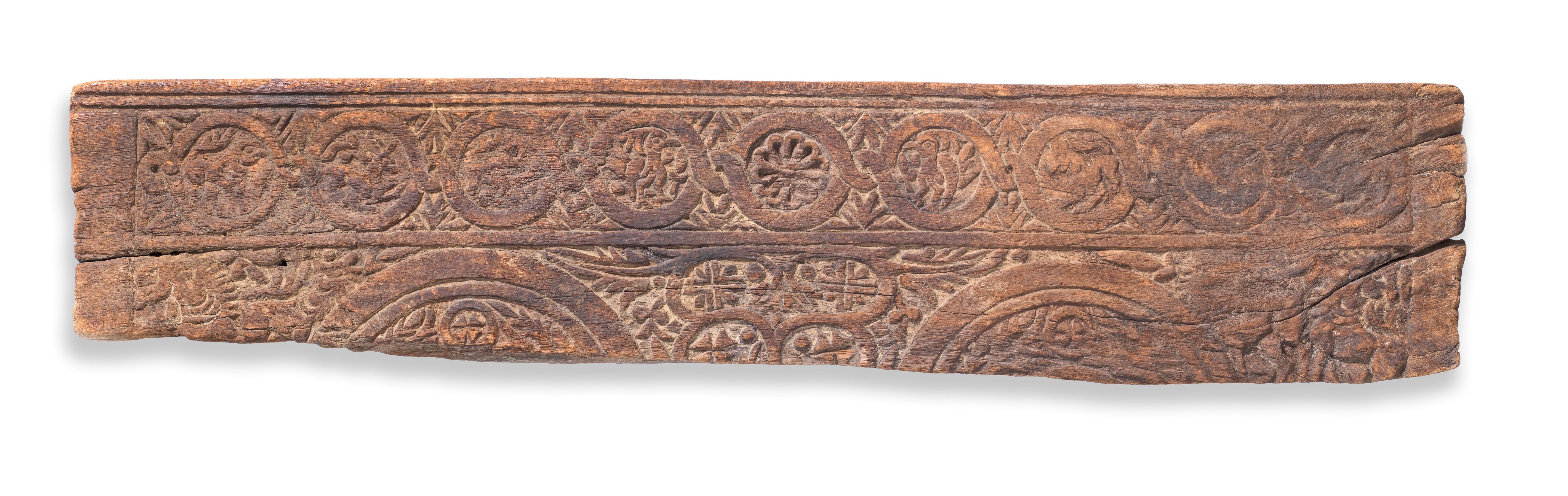 Bonhams : A Coptic wood panel fragment with cross and animal roundels ...