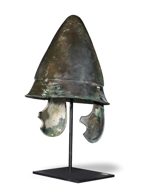 Bonhams : A Greek bronze pilos helmet with cheek pieces