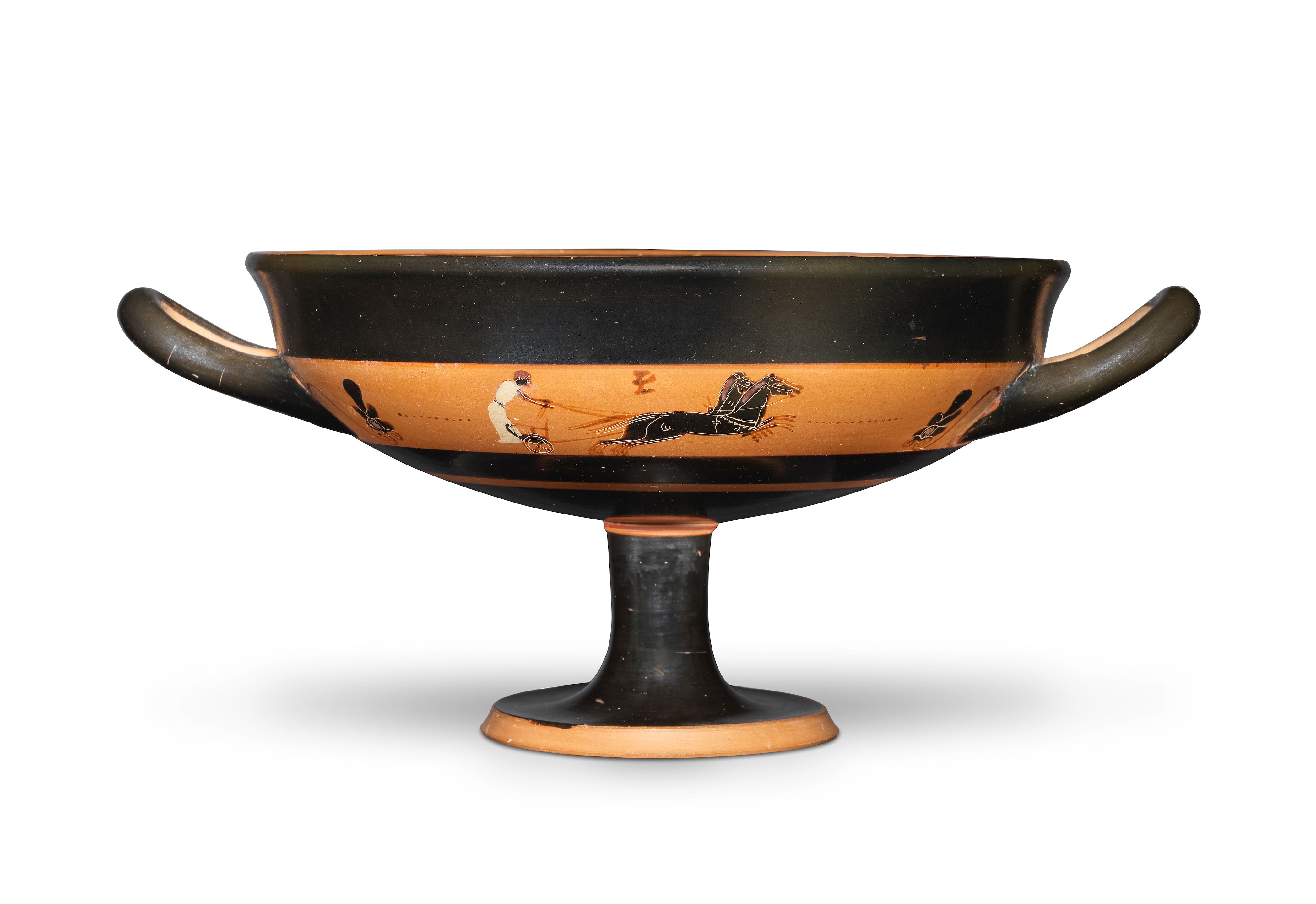 Bonhams : An Attic black-figure Little Master band cup with racing chariots