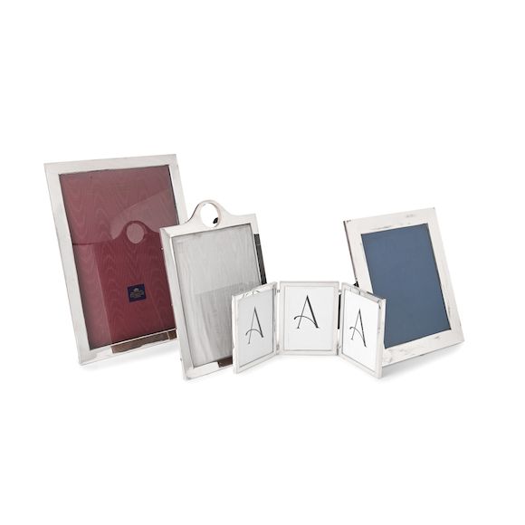 Bonhams : Three large silver photograph frames and a folding tryptic ...