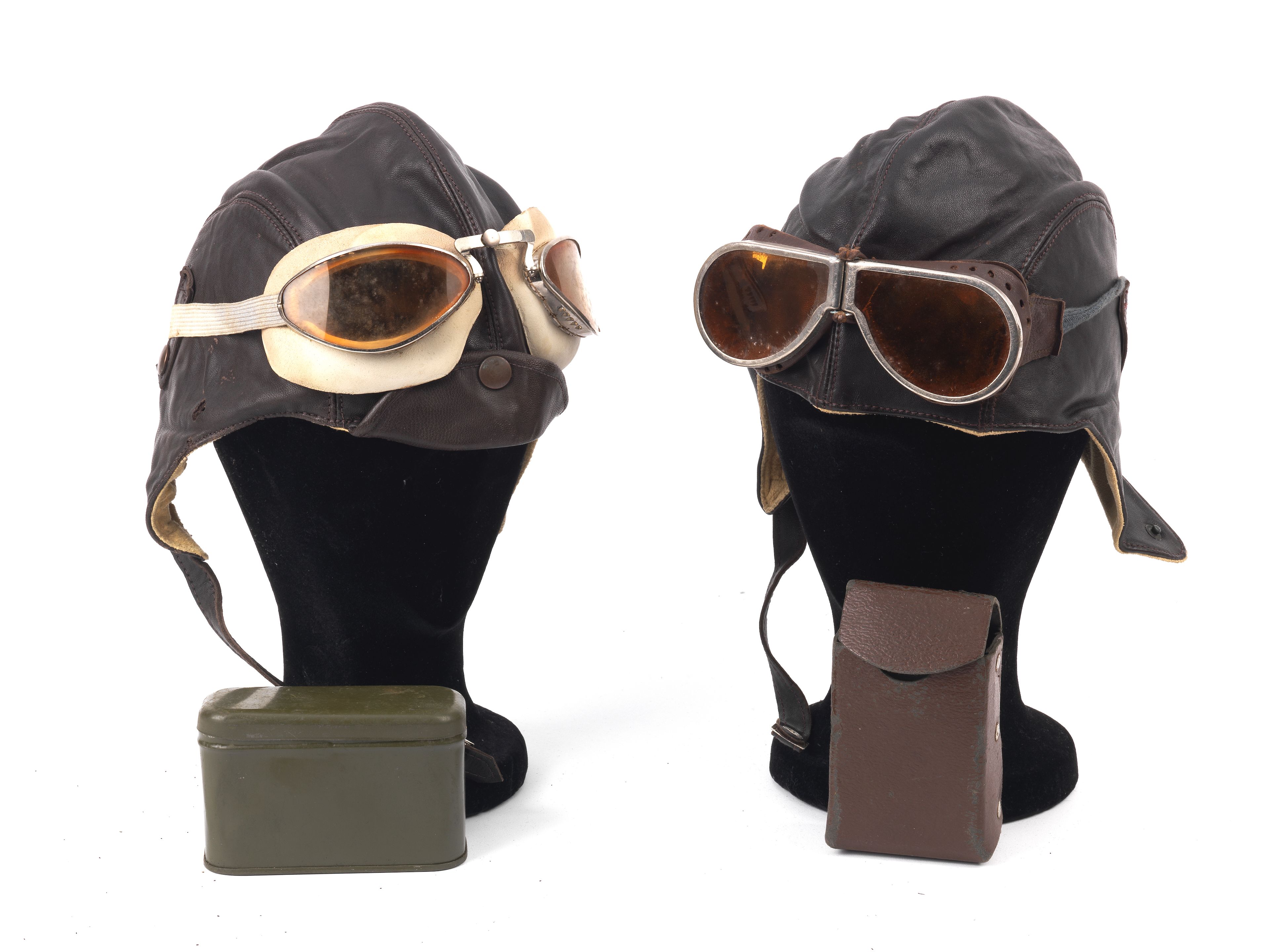 Bonhams Cars : Two leather helmets and two pairs of driving goggles to ...