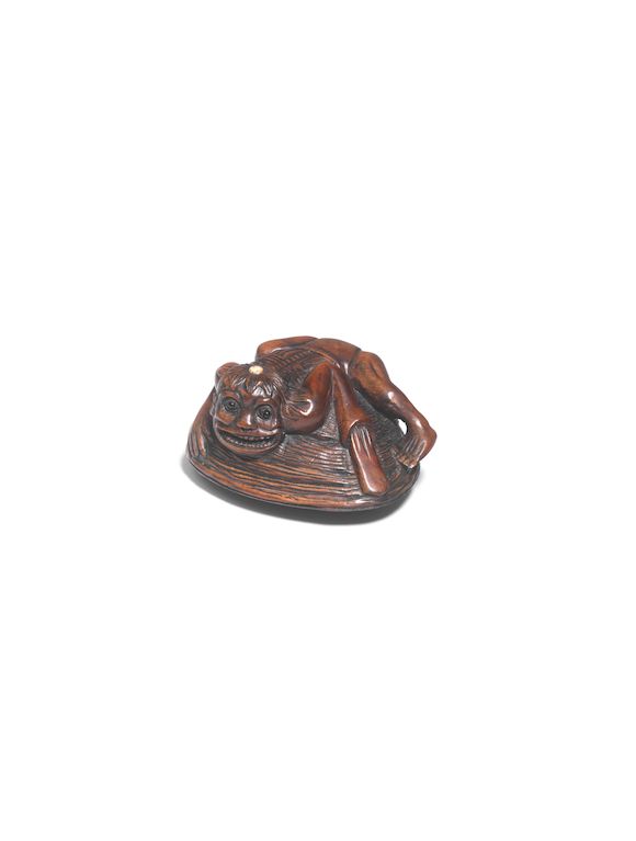 Bonhams : A WOOD NETSUKE OF A KAPPA ON A CLAM By Nissho, Edo period ...