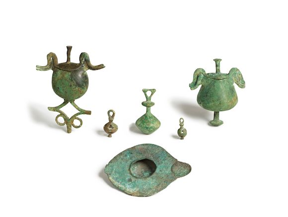 Bonhams : A group of two Greek bronze pyxides, three bronze pendants ...